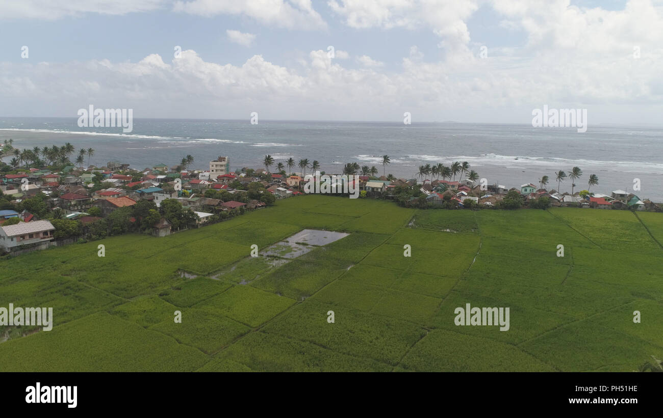 Aerial view of seashore with coastal town, beach, lagoons and coral ...