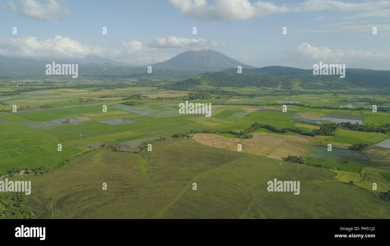 Mountain valley with farmland, rice terraces near mount Iriga. Aerial ...