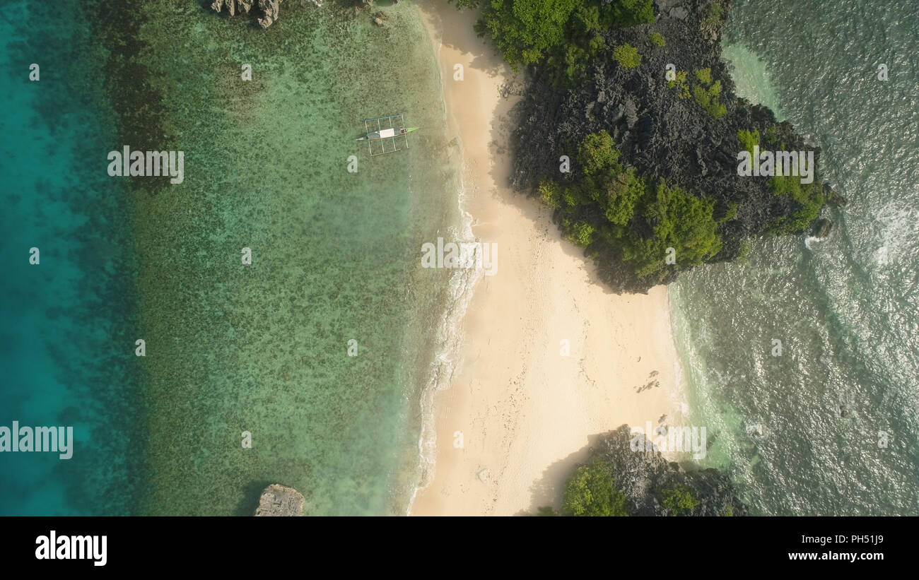 Aerial view island with sand beach and turquoise water in blue lagoon ...