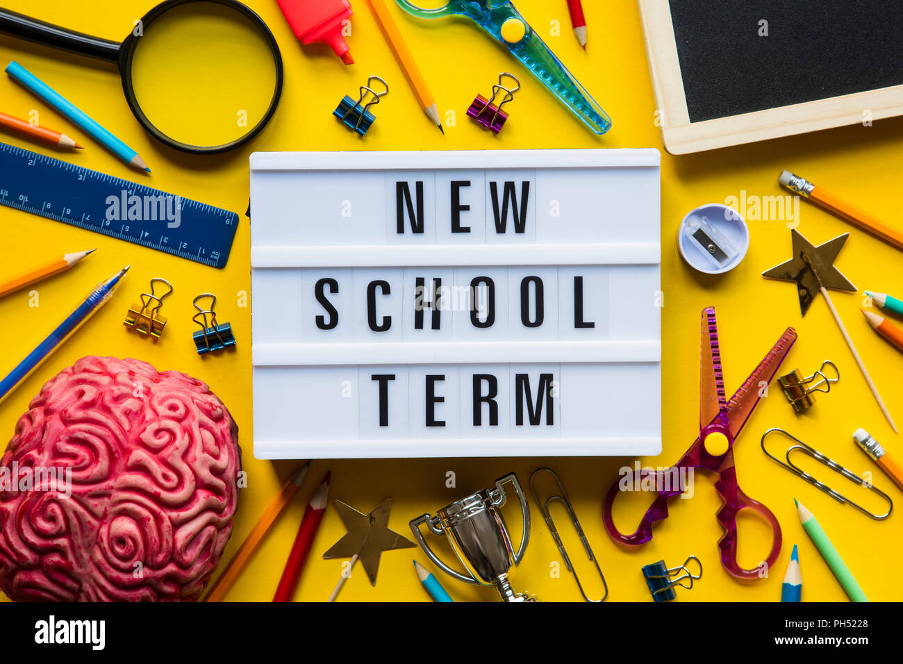 New school term lightbox message on a bright yellow background Stock ...
