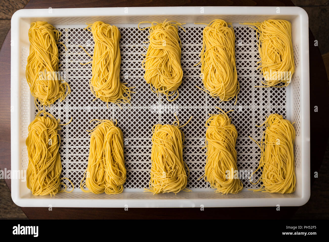 Overhead shot of rows of freshly made spaghetti Stock Photo - Alamy