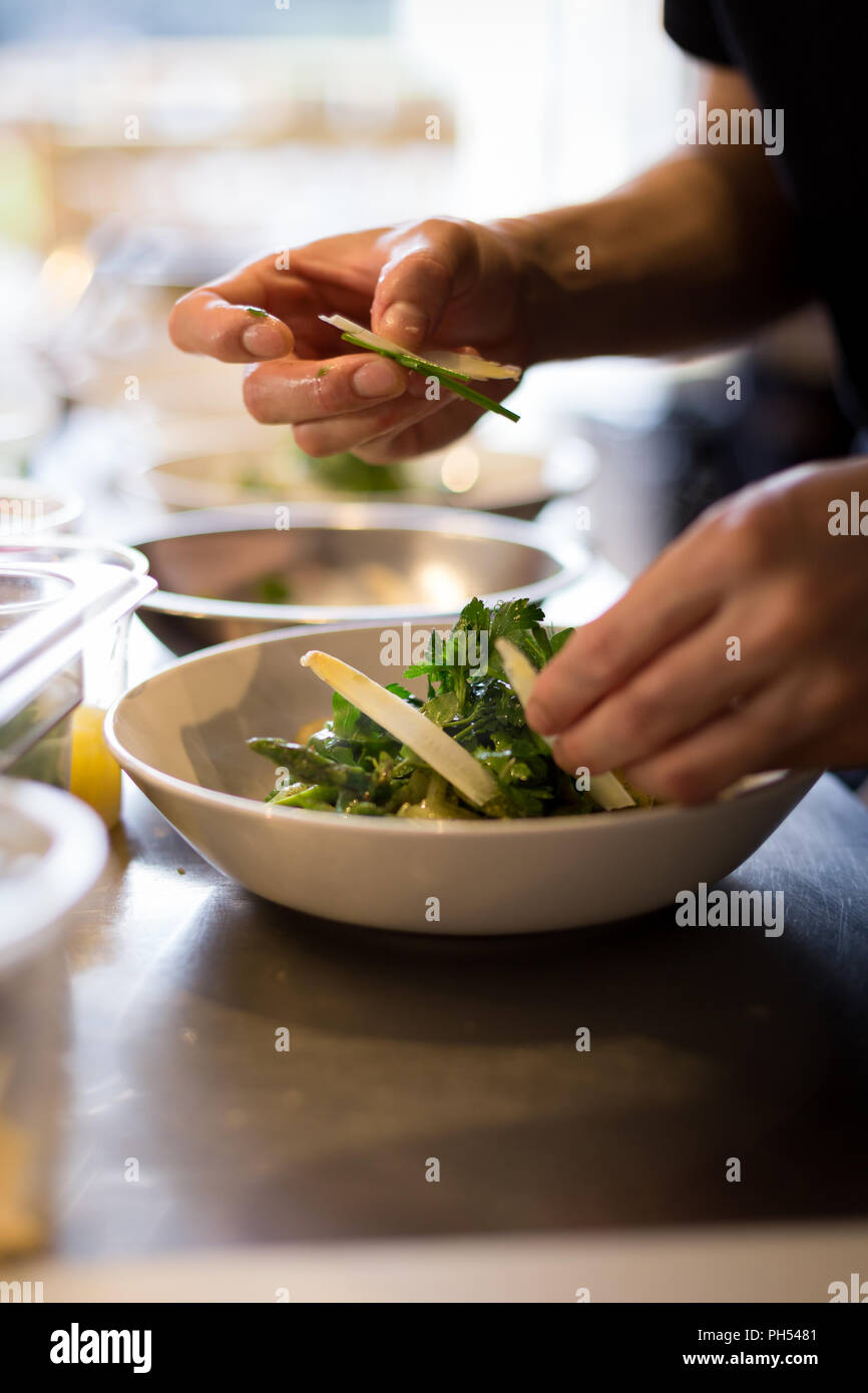 Chef plating fresh ricotta gnocchi in an Italian restaurant Stock Photo ...
