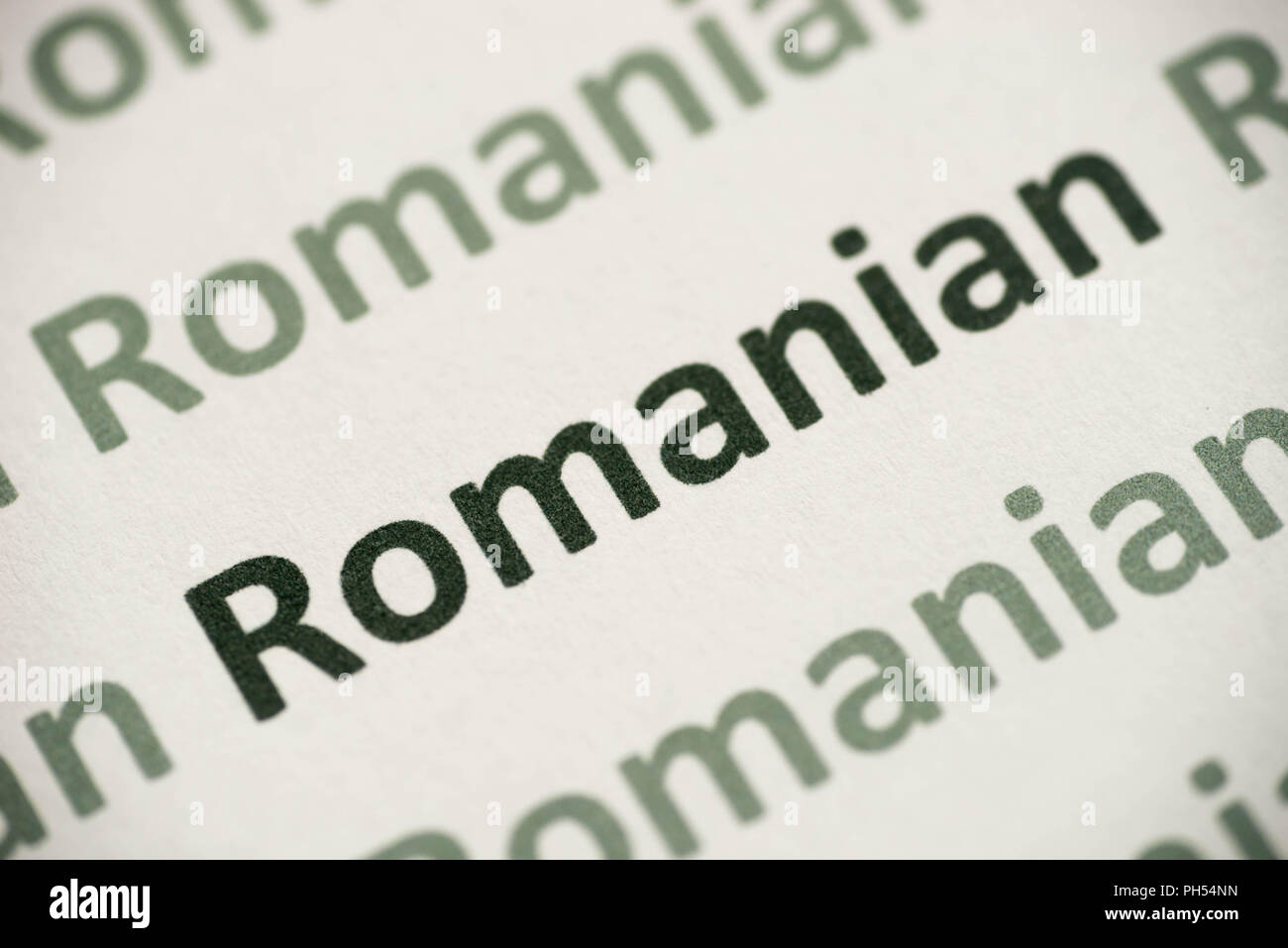 word Romanish language printed on white paper macro Stock Photo - Alamy