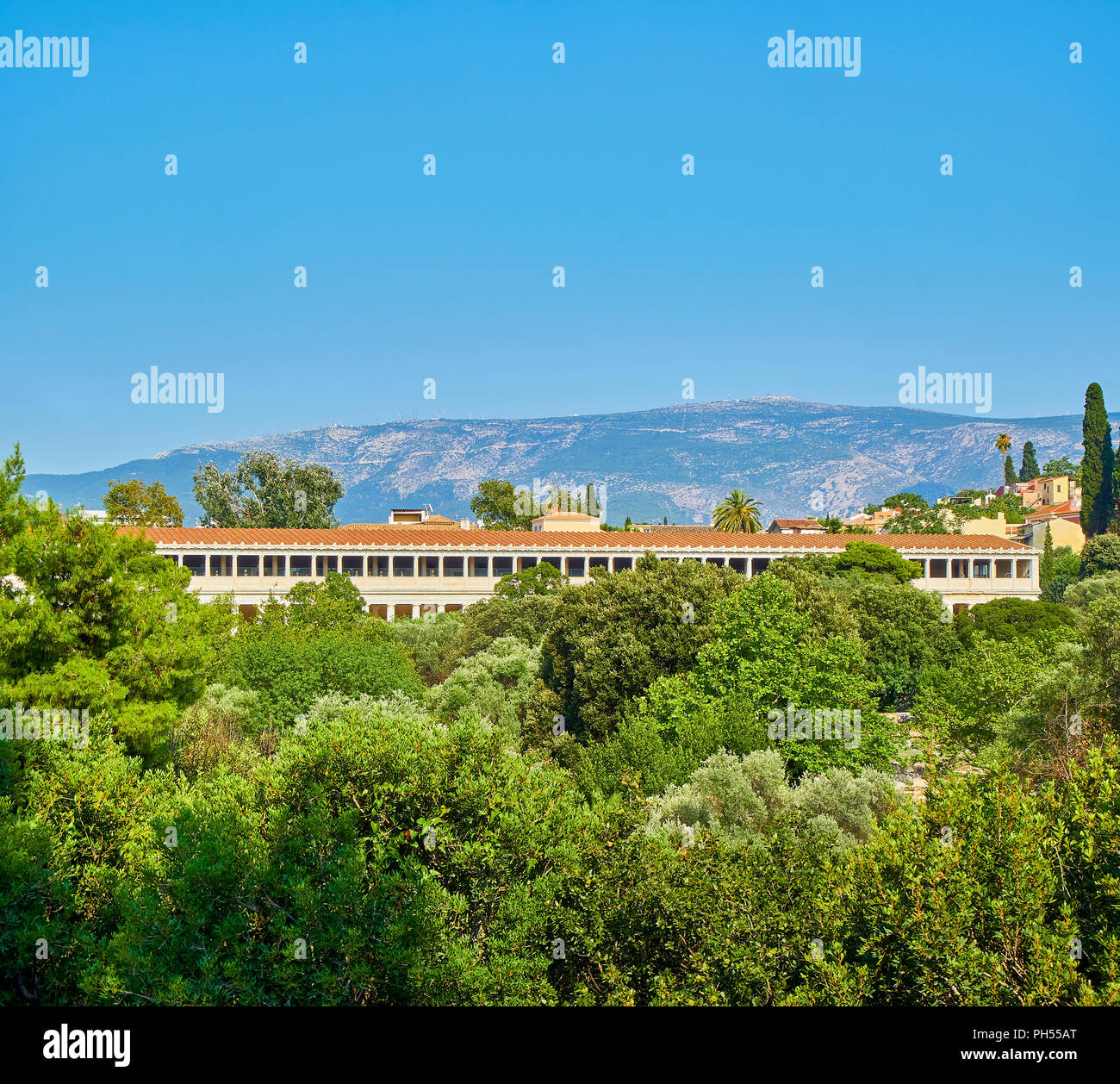 Principal facade of the Stoa of Attalos building between the tree of ...