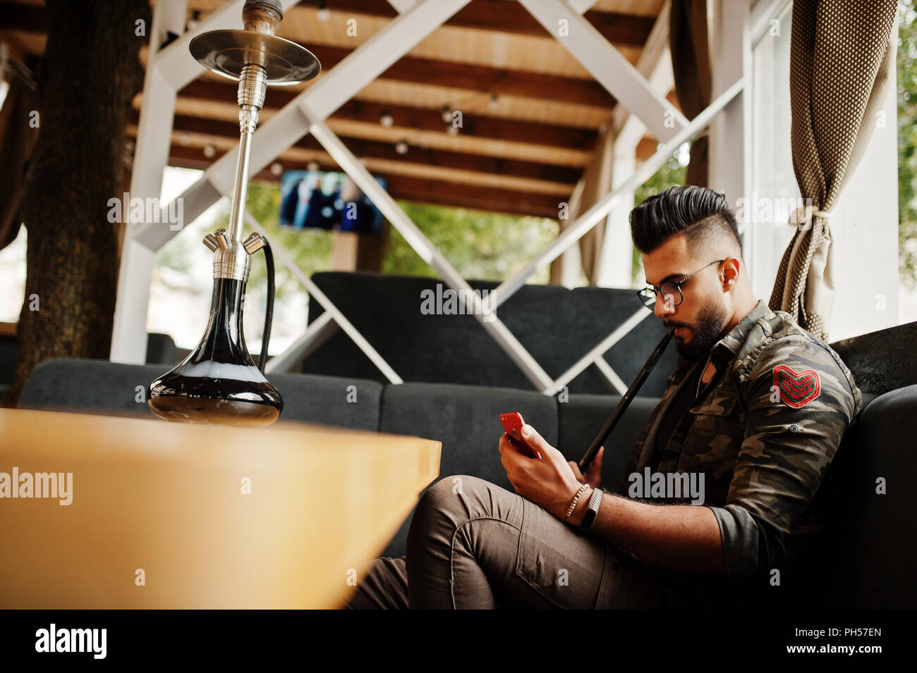 Arab man smoking shisha on hi-res stock photography and images - Alamy