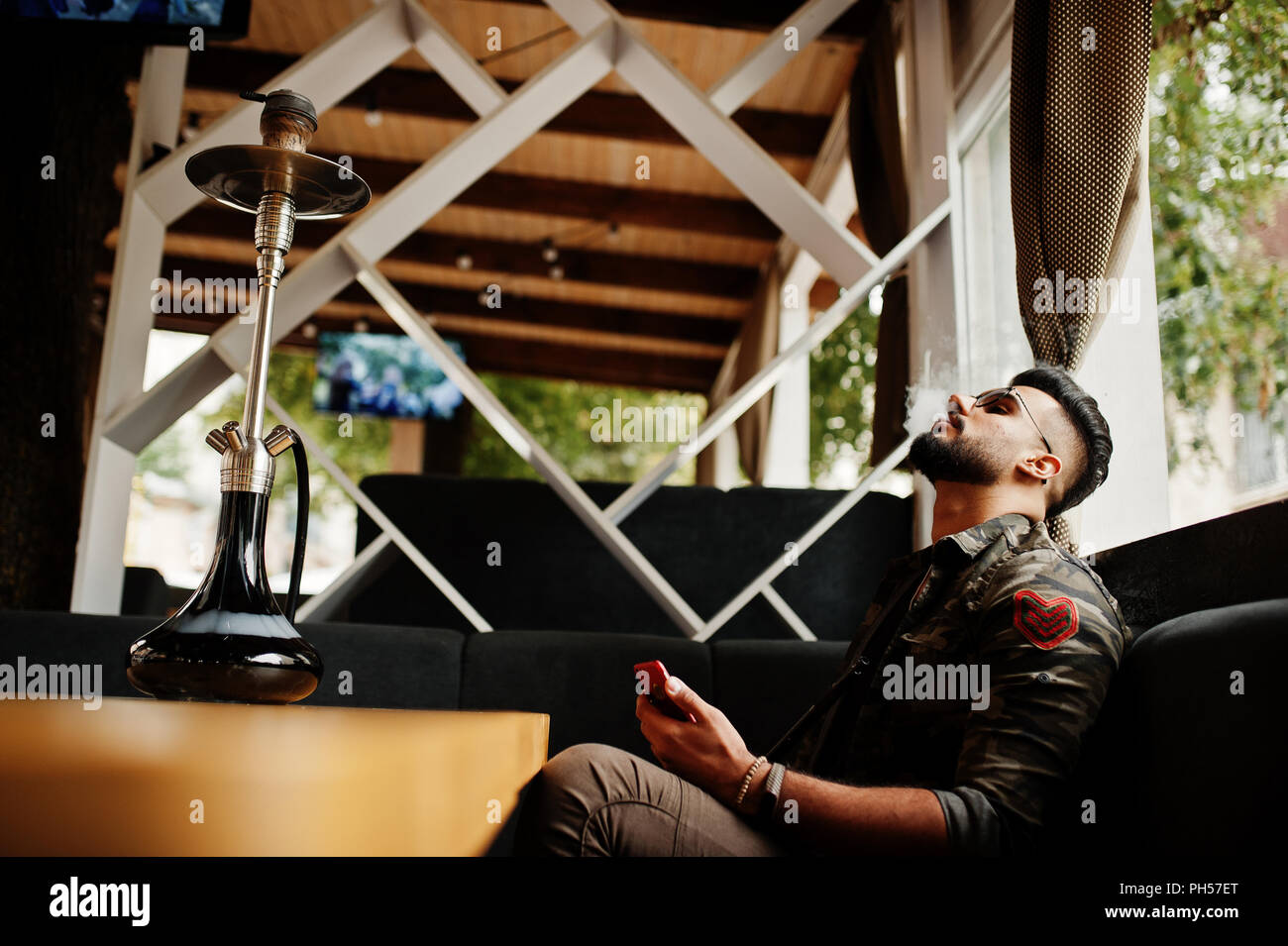 Arab man smoking shisha on hi-res stock photography and images - Alamy