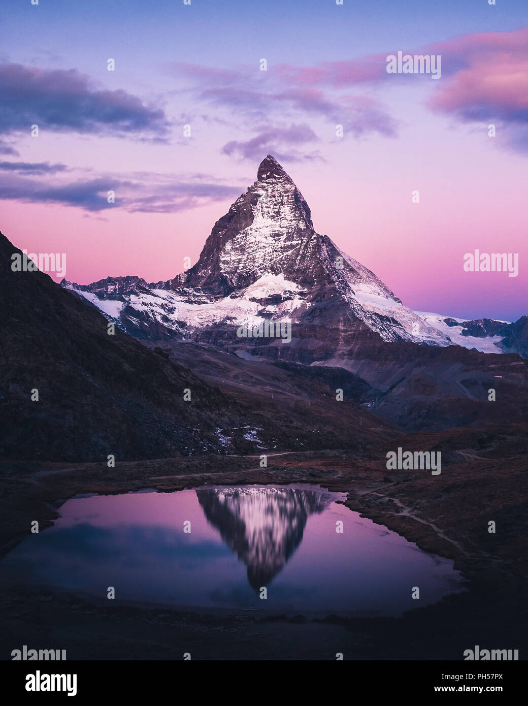 Beautiful and colourful sunrise and reflection of Matterhorn mountain ...