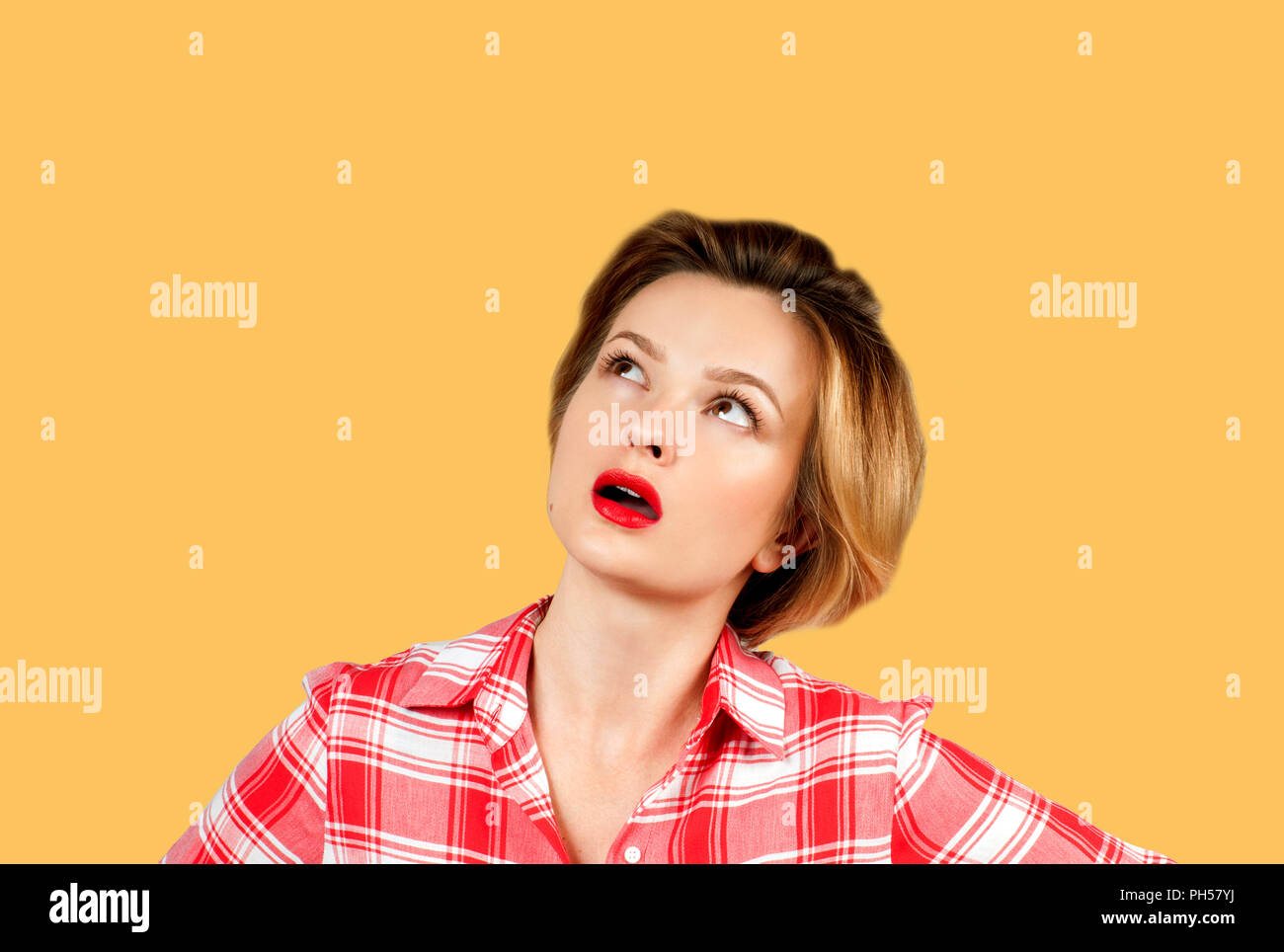 Thinking business woman with questioning face expression looking up on ...