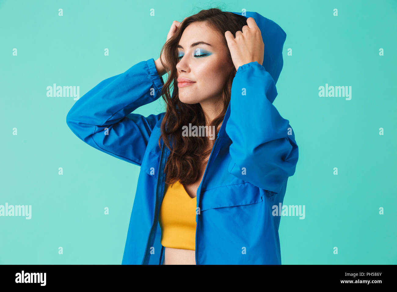 Putting on raincoat hi-res stock photography and images - Alamy