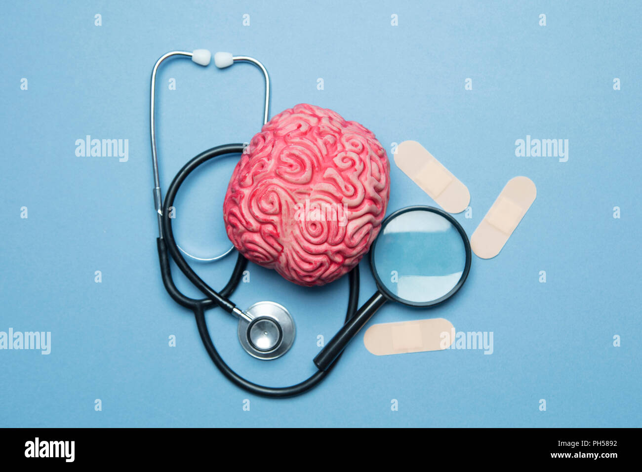 Mental health concept. human brain on a blue background Stock Photo - Alamy