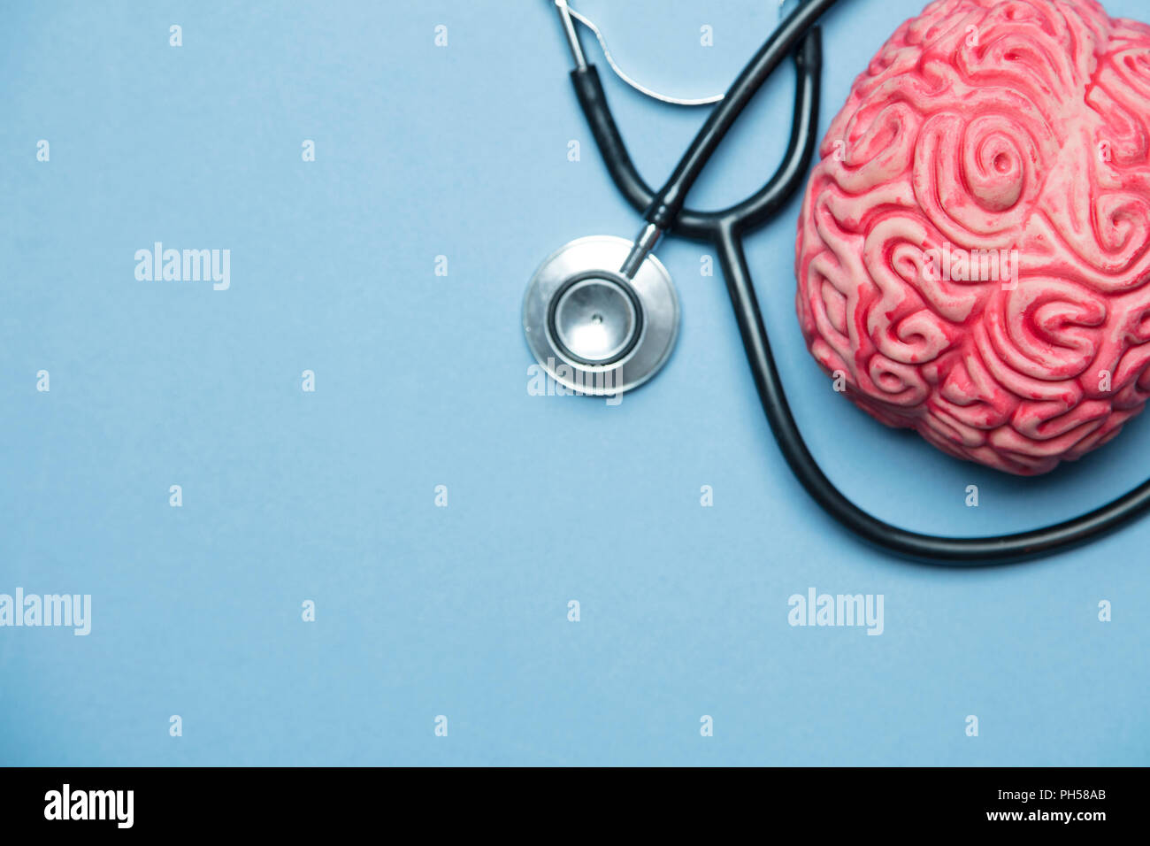 Mental health concept. human brain on a blue background Stock Photo - Alamy