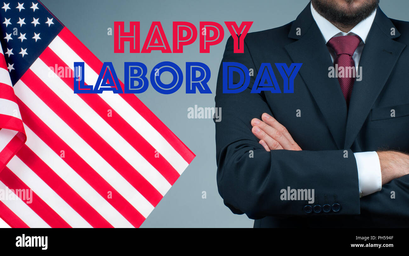 Happy Labor Day. USA flag. Business man in suit standing with crossed ...