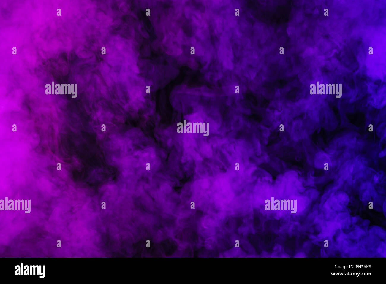 purple smoke on abstract black background Stock Photo - Alamy