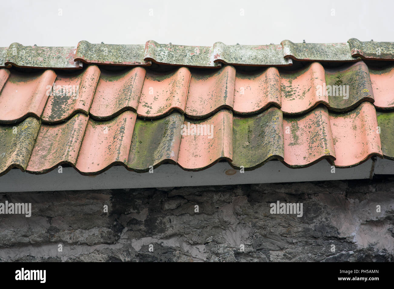 Spanish style ceramic tile roof with blue sky. Background texture ...
