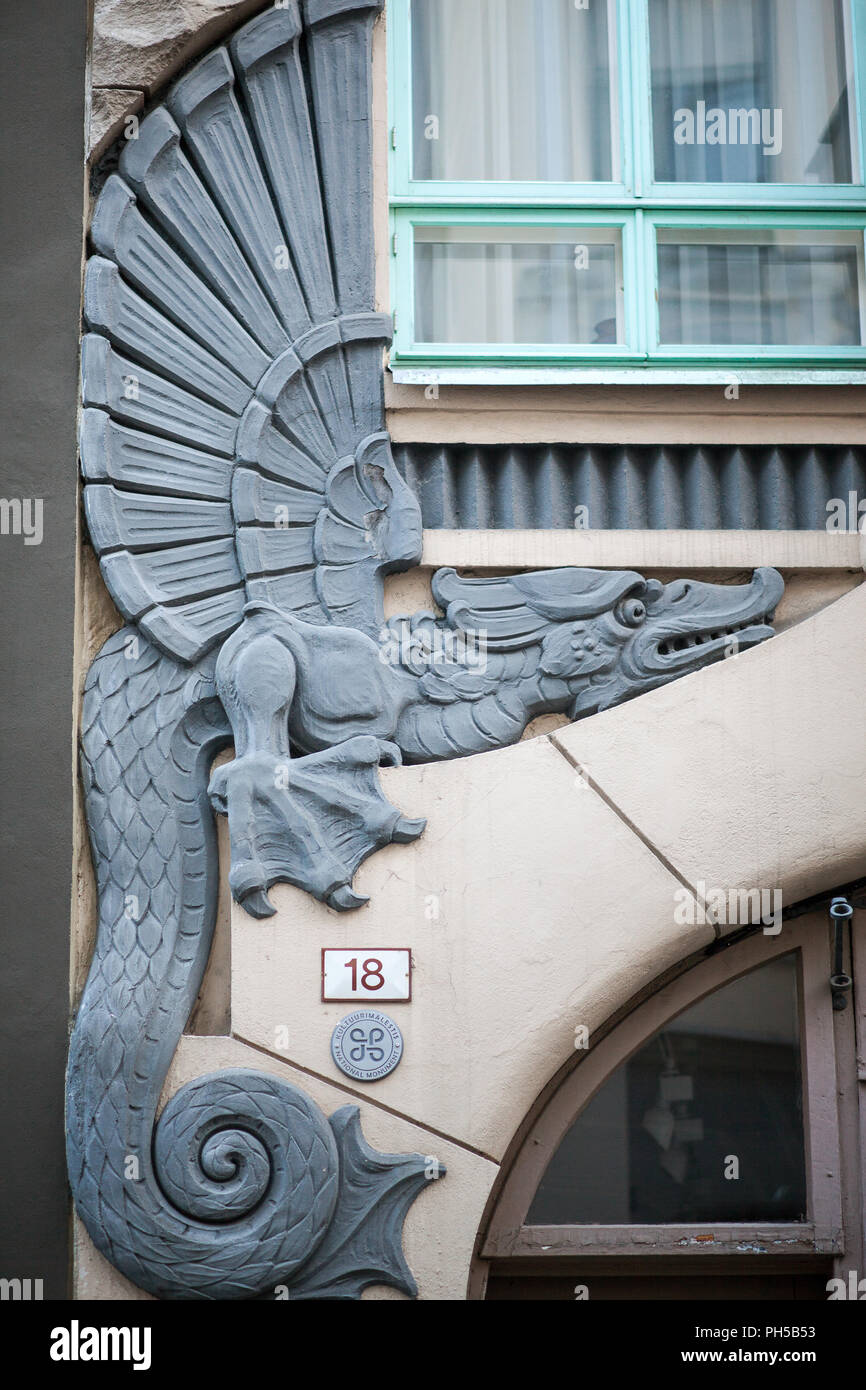 The Sculpture of the Dragon on the facade of the house Stock Photo - Alamy
