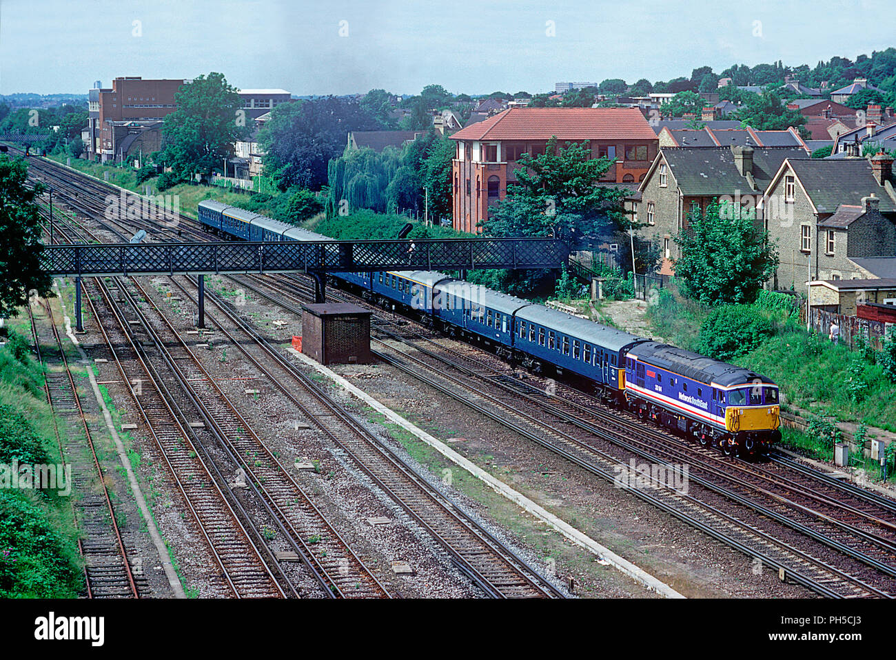 A class 33 diesel locomotive number 33114 "Ashford 150" with 4TC units ...