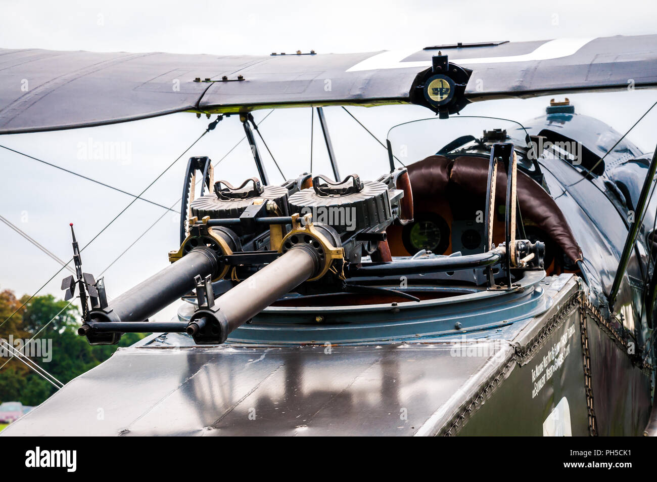 Twin machine guns pointing back from a biplane cockpit Stock Photo - Alamy