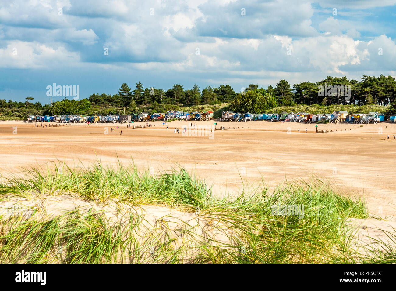 Holkham beach and beach huts with sand dunes Stock Photo - Alamy