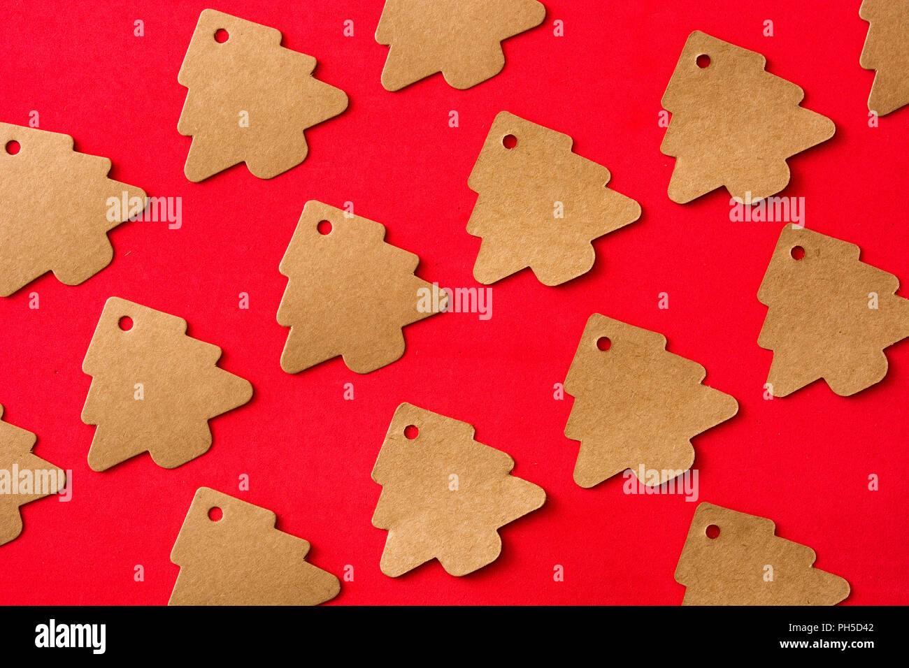 Christmas tree label pattern on red background Stock Photo - Alamy