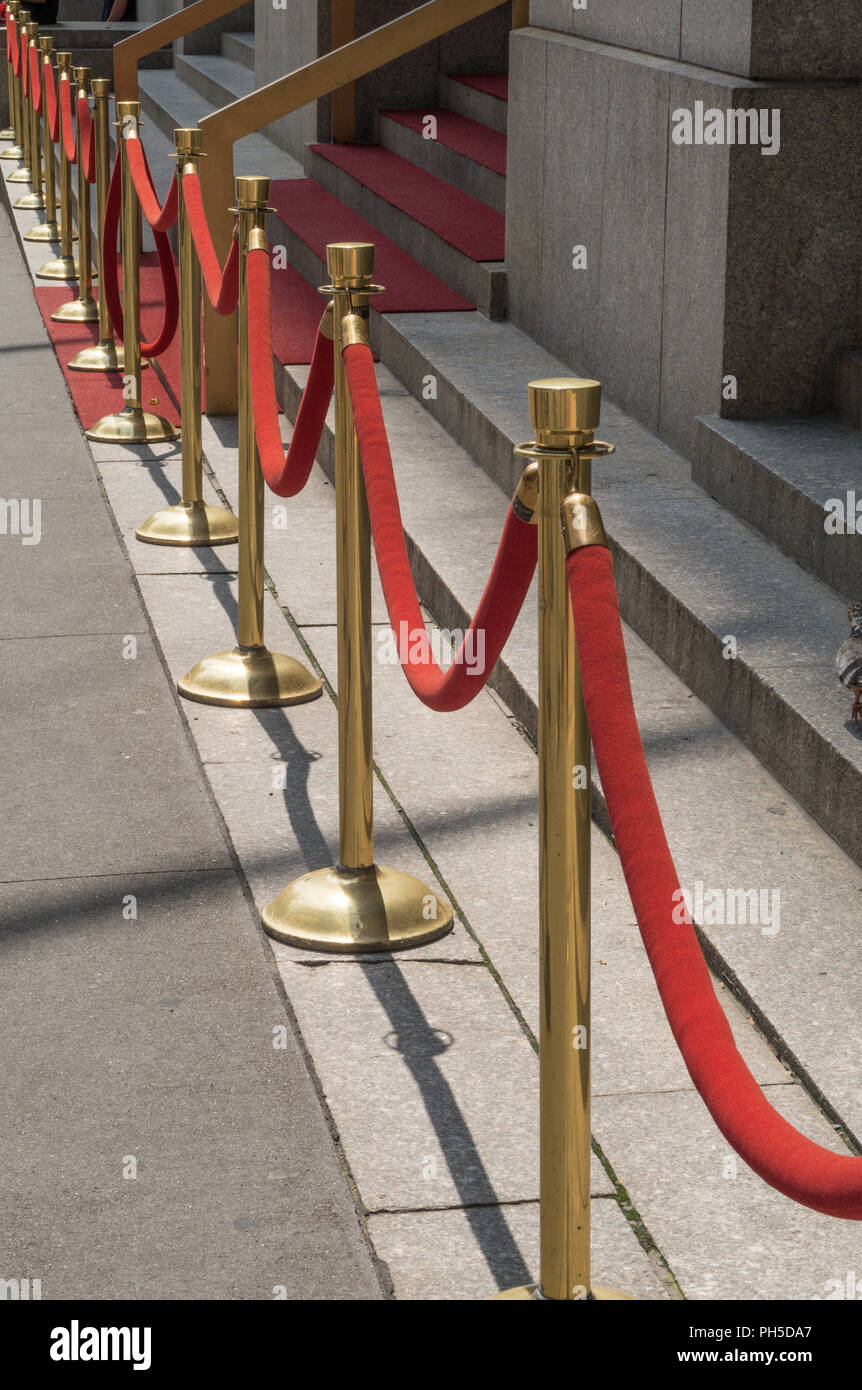 Brass stanchion with red velvet rope hi-res stock photography and ...