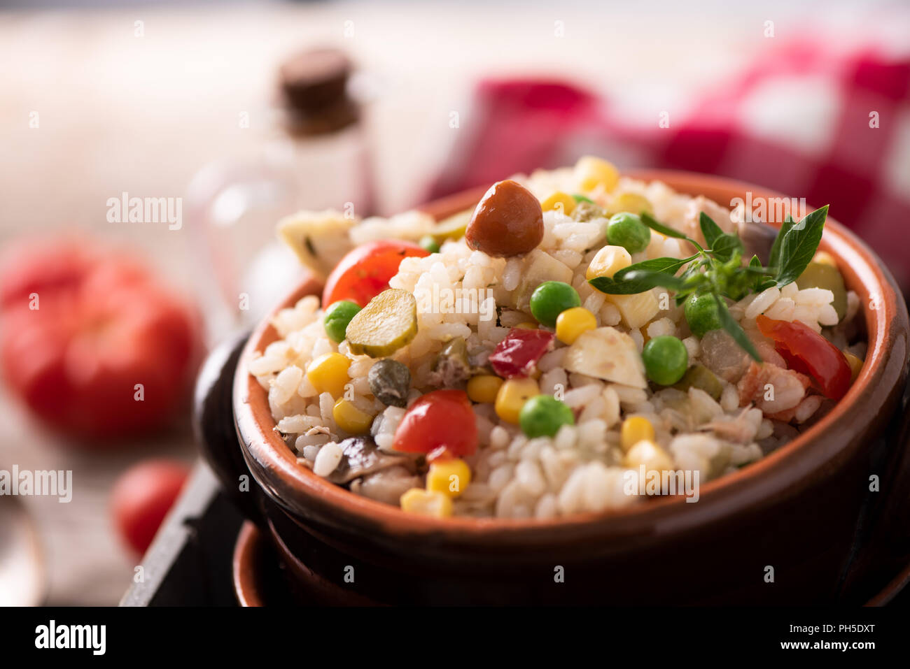 Traditional italian rice salad on wood table Stock Photo - Alamy