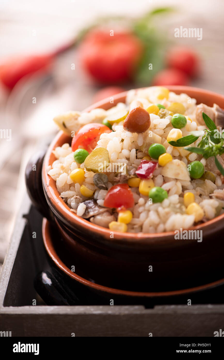 Traditional italian rice salad on wood table Stock Photo - Alamy