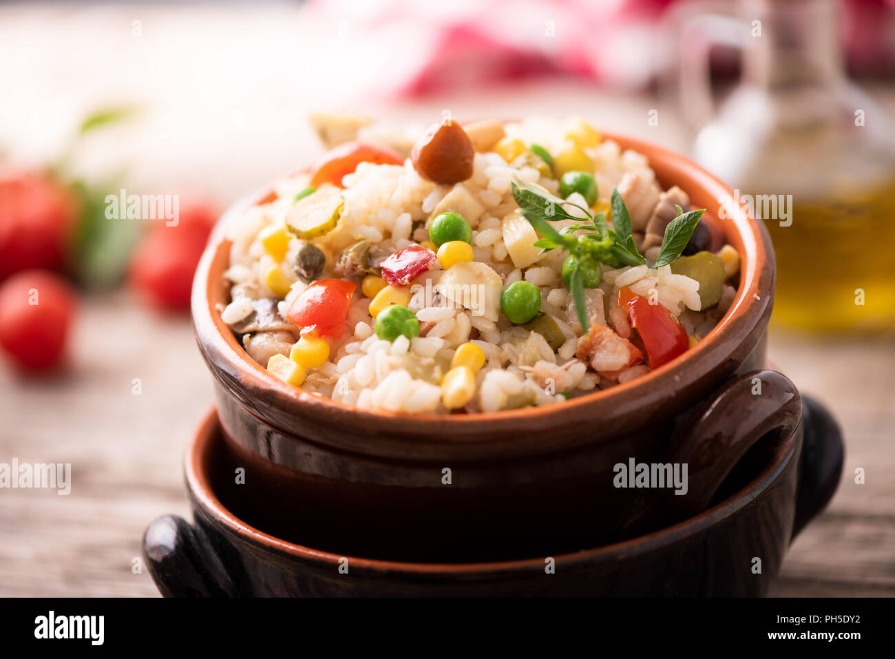 Traditional italian rice salad on wood table Stock Photo - Alamy
