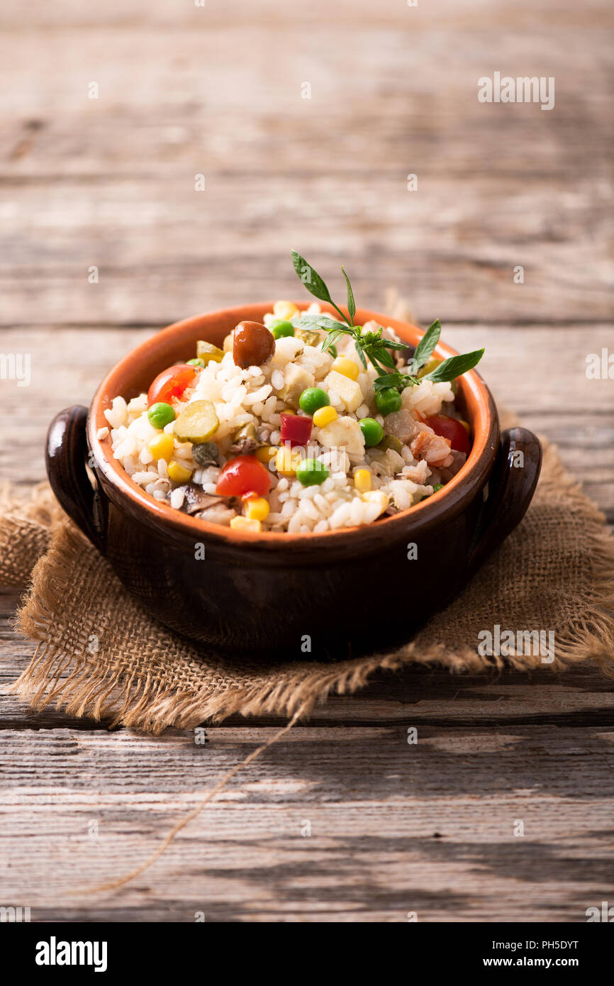 Traditional italian rice salad on wood table Stock Photo - Alamy