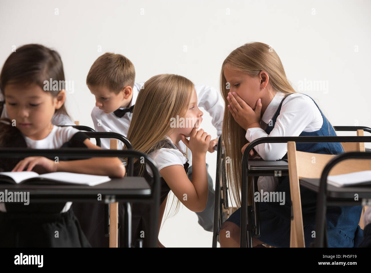 School children in classroom at lesson. The little boys and girls ...