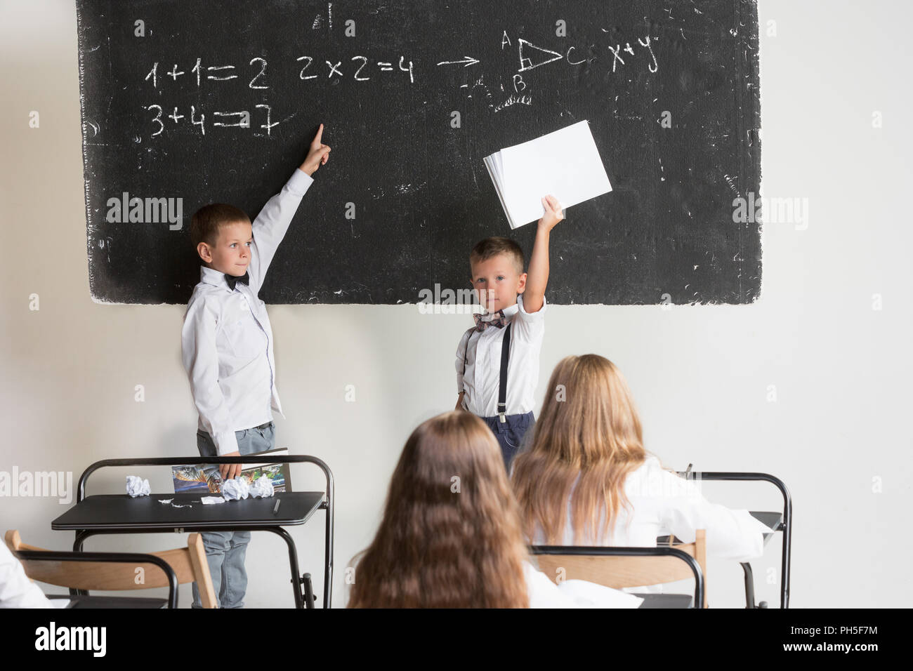 School children in classroom at lesson. The little boys and girls ...