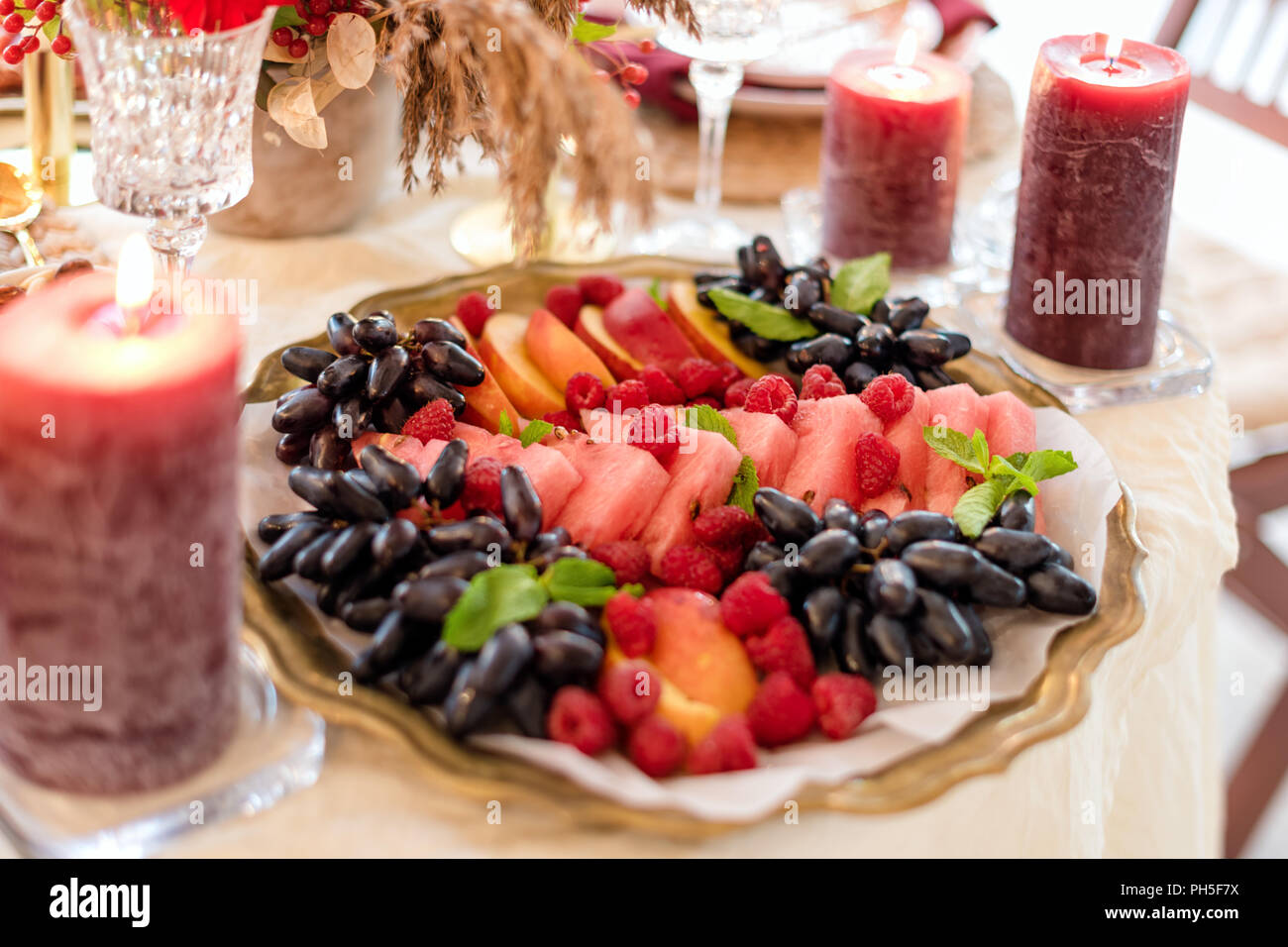 Luxury table settings for fine dining with candles and glassware ...