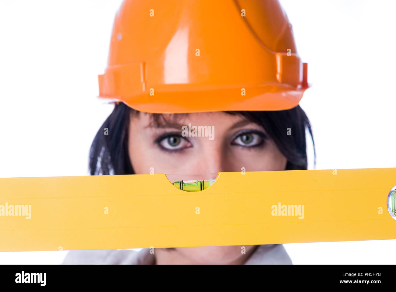Attractive woman with measuring level. Focus on tool Stock Photo - Alamy