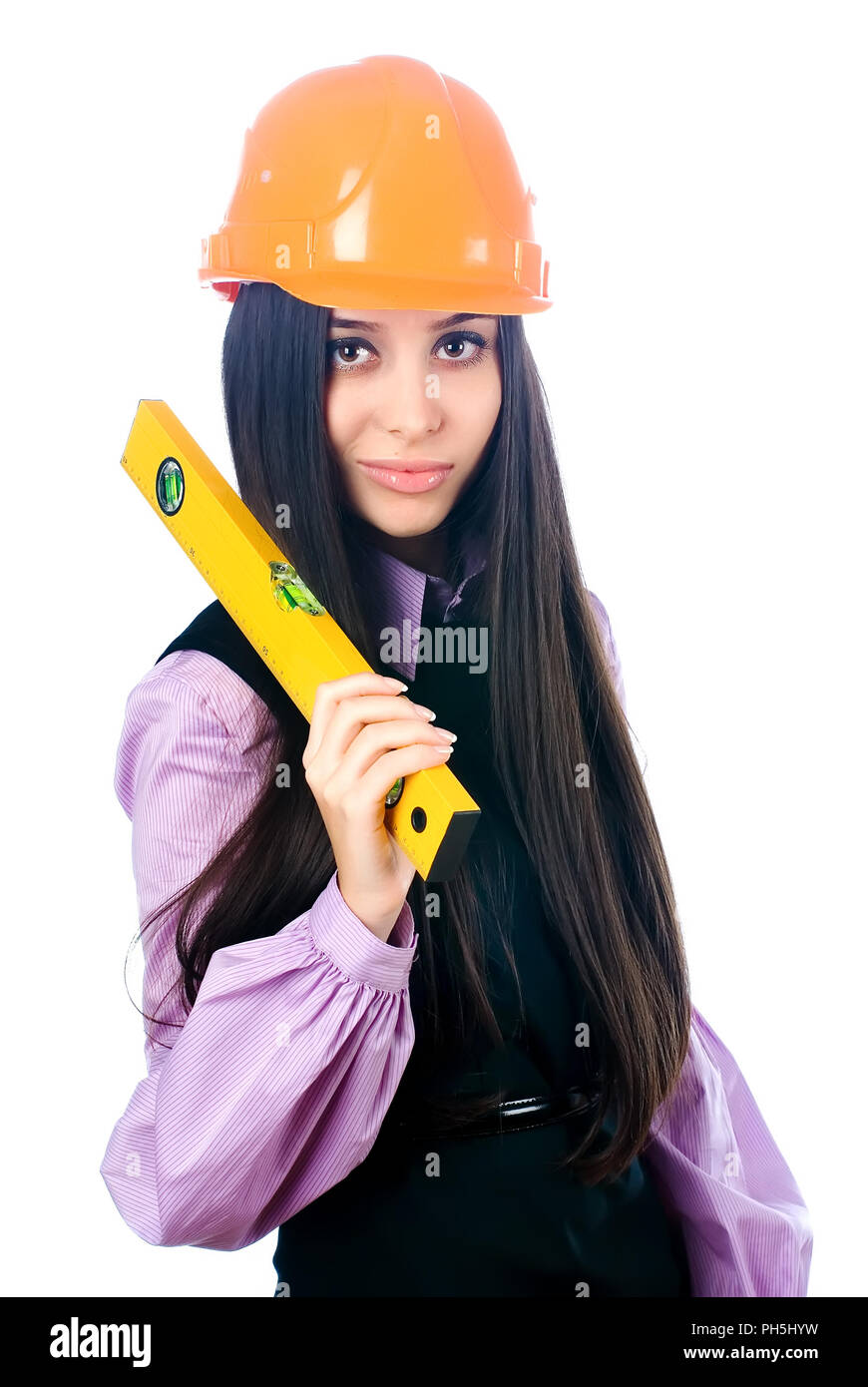 Attractive girl in helmet with level Stock Photo - Alamy