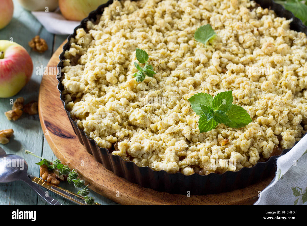 Traditional English cuisine. Apples crumble, crisp in baking dish on ...