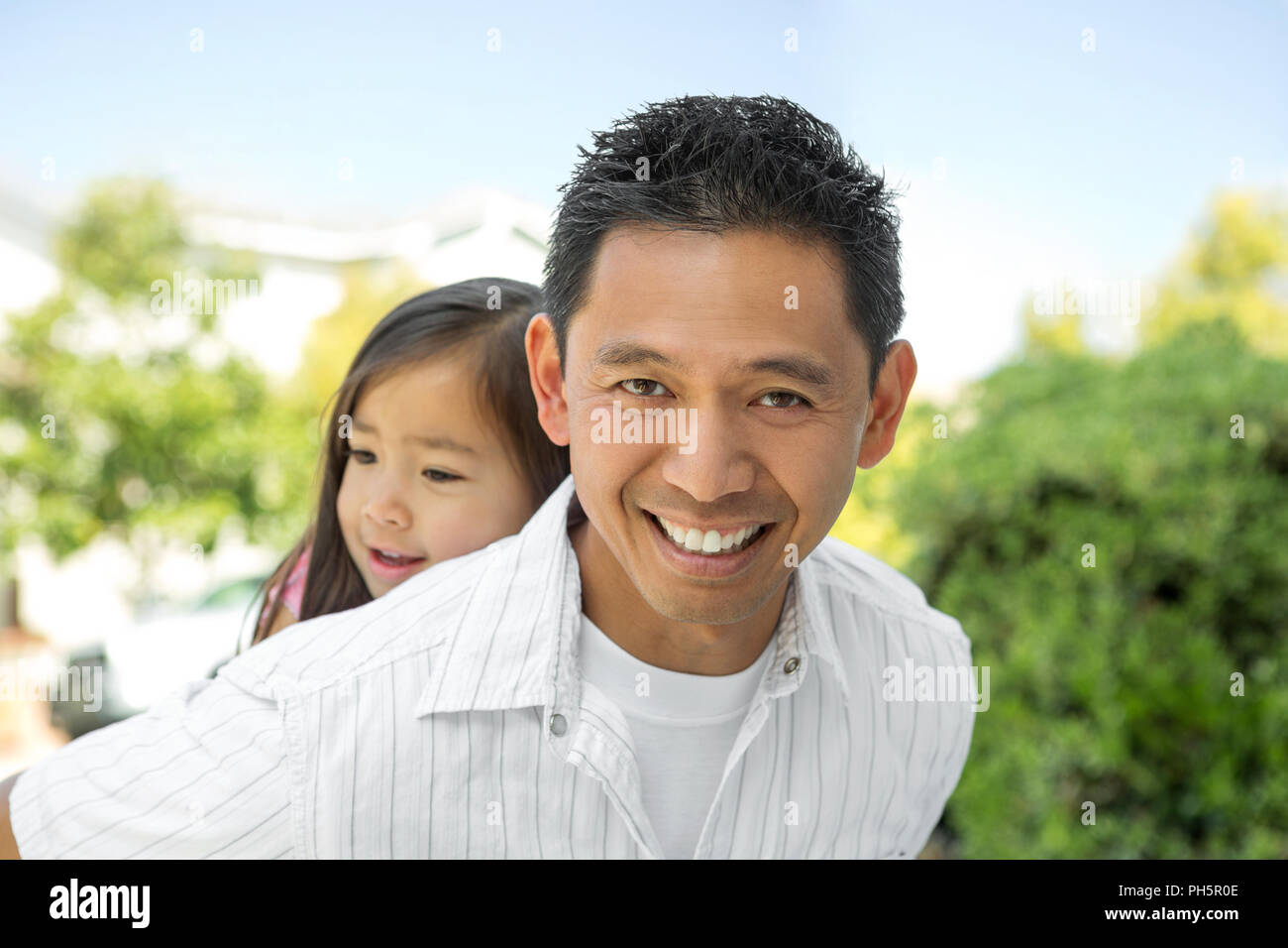 Asian father with his daughter Stock Photo - Alamy