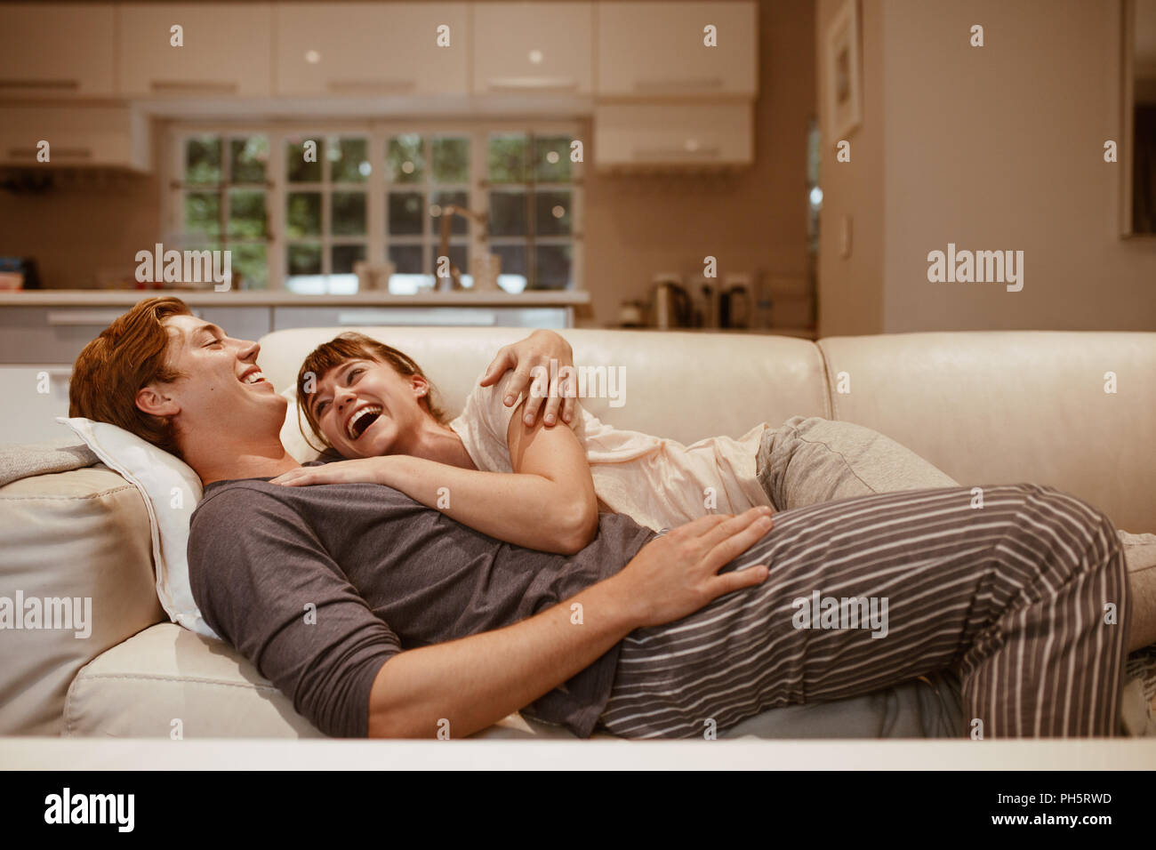 Laughing sleeping hi-res stock photography and images - Alamy
