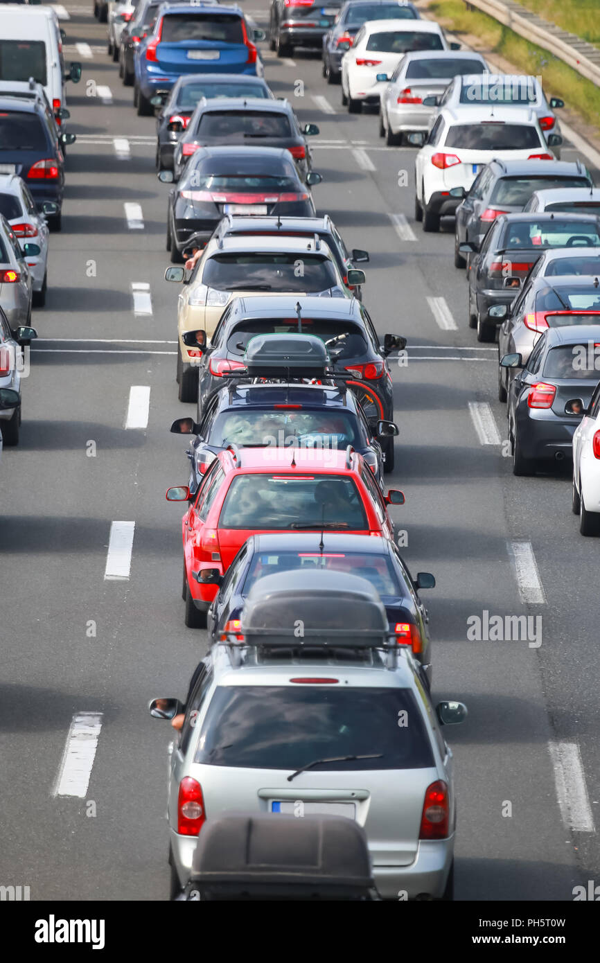 Rear view of traffic jam of lined up cars stuck on the highway toll ...