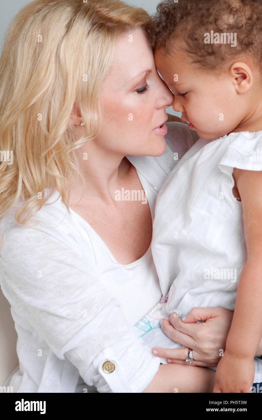 Portrait of loving multicultural family smiling Stock Photo - Alamy