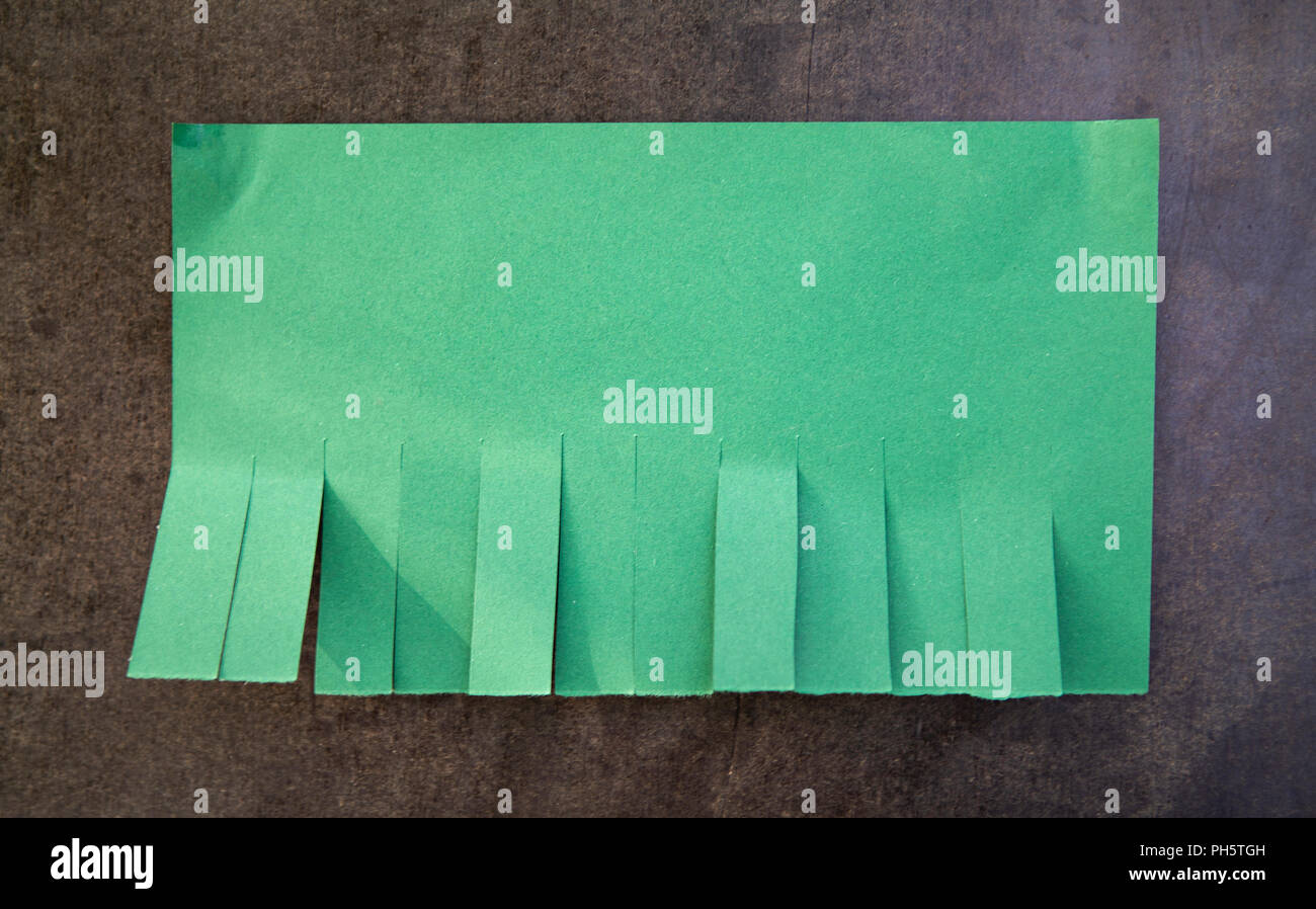 Blank green paper with tear off tabs Stock Photo - Alamy