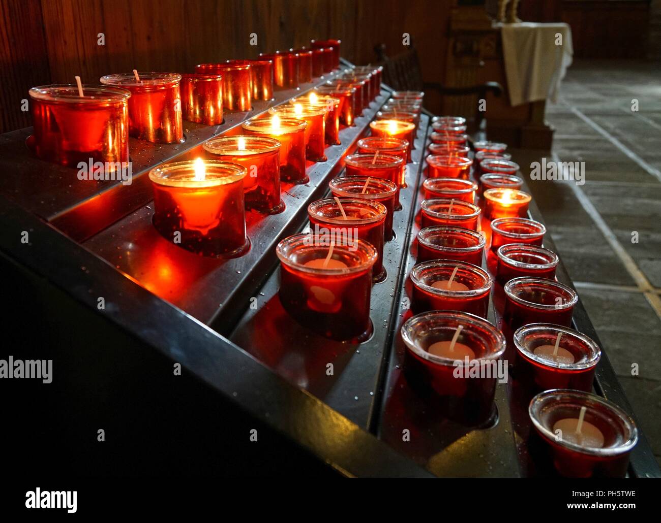 Igniting candles hi-res stock photography and images - Alamy