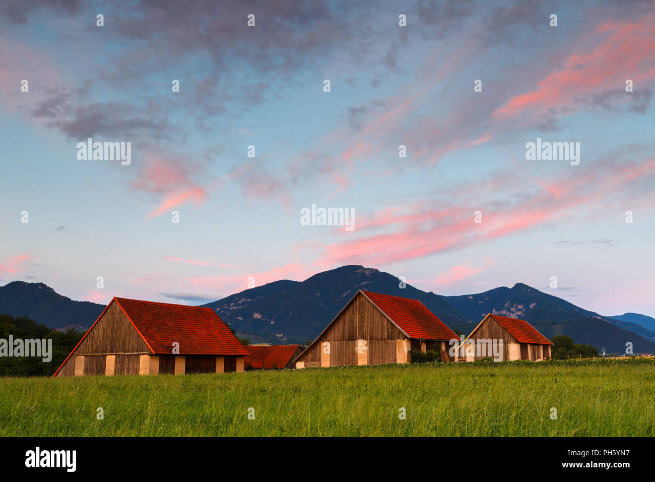 Rural landscape with traditional barns and Velka Fatra national Park in ...