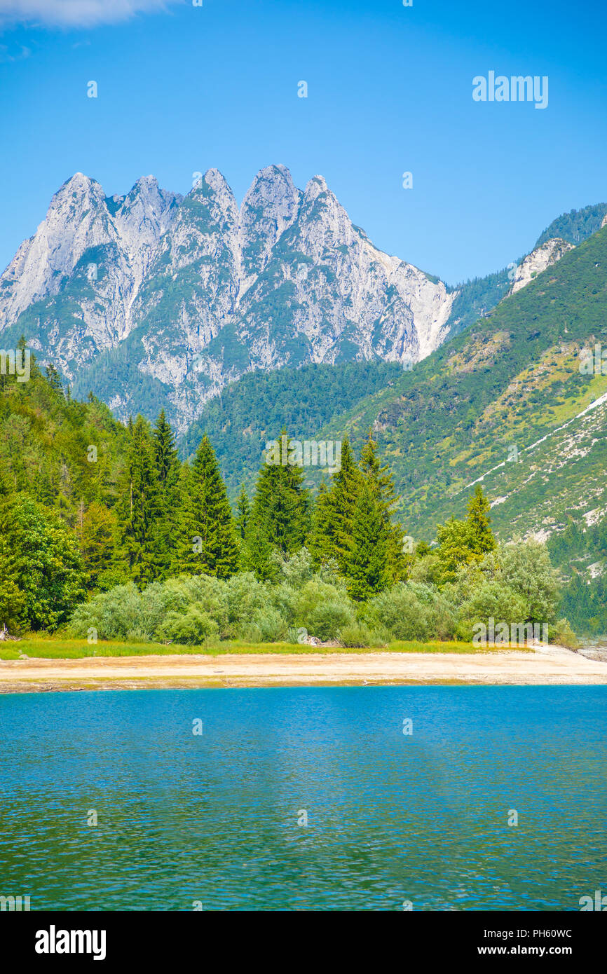 Lake Predil with turquoise water and mountains in background near ...