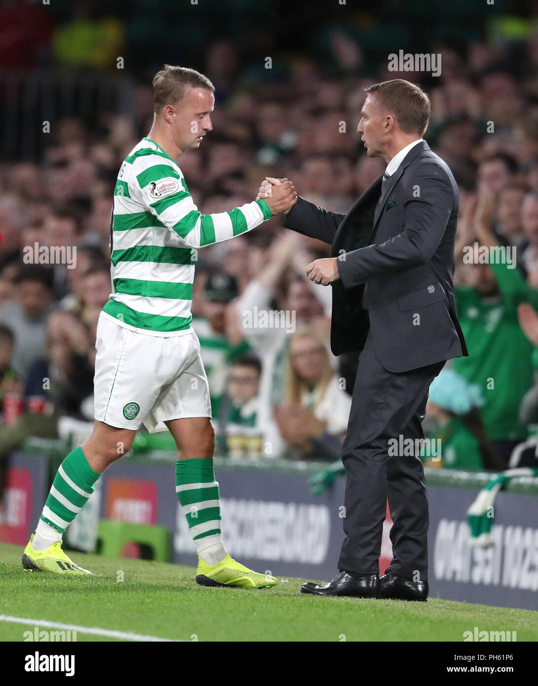 Celtic manager Brendan Rodgers shakes hands with Leigh Griffiths as he ...