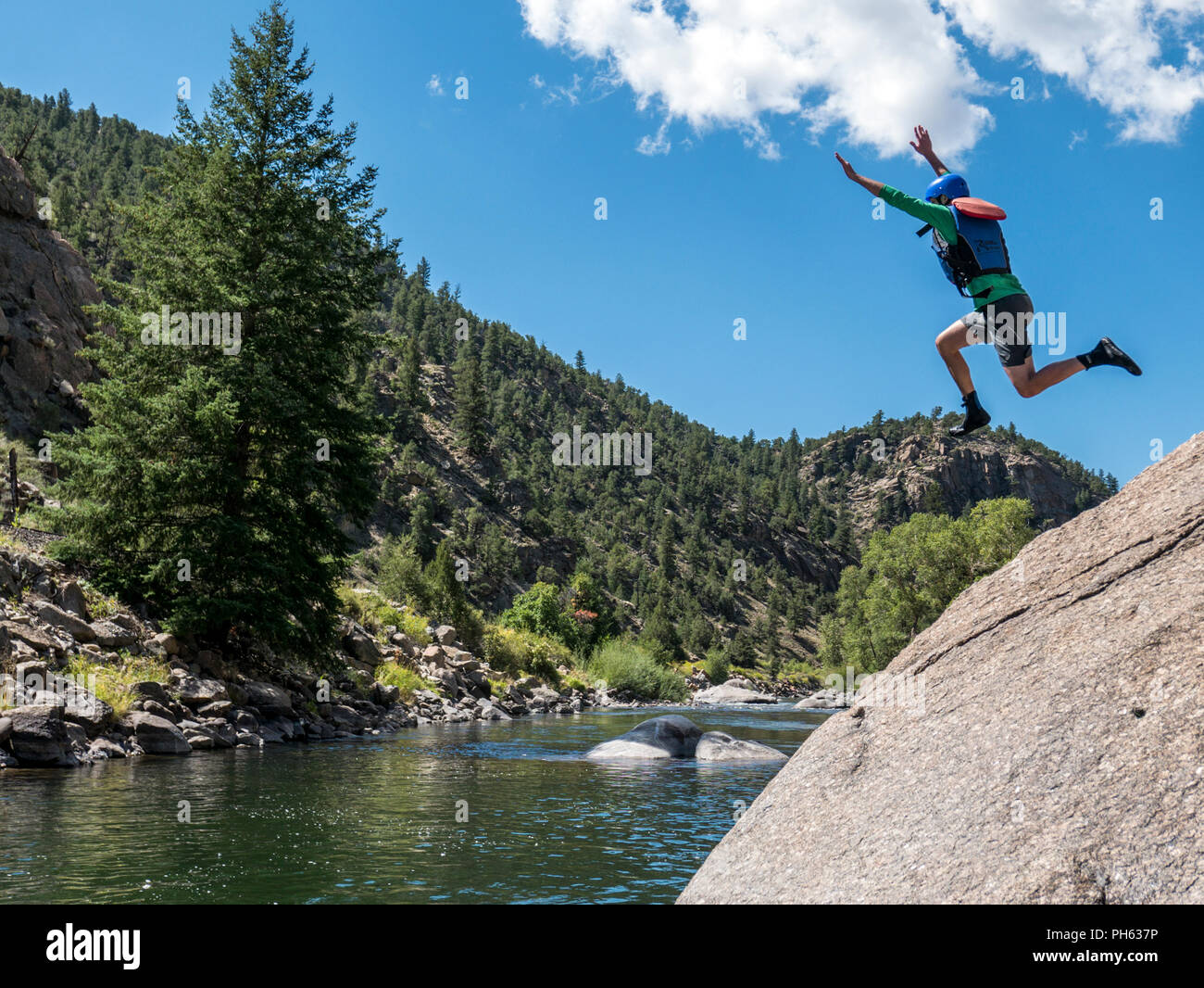 Rafters jumping off a rock into the Arkansas RIver; Browns Canyon ...