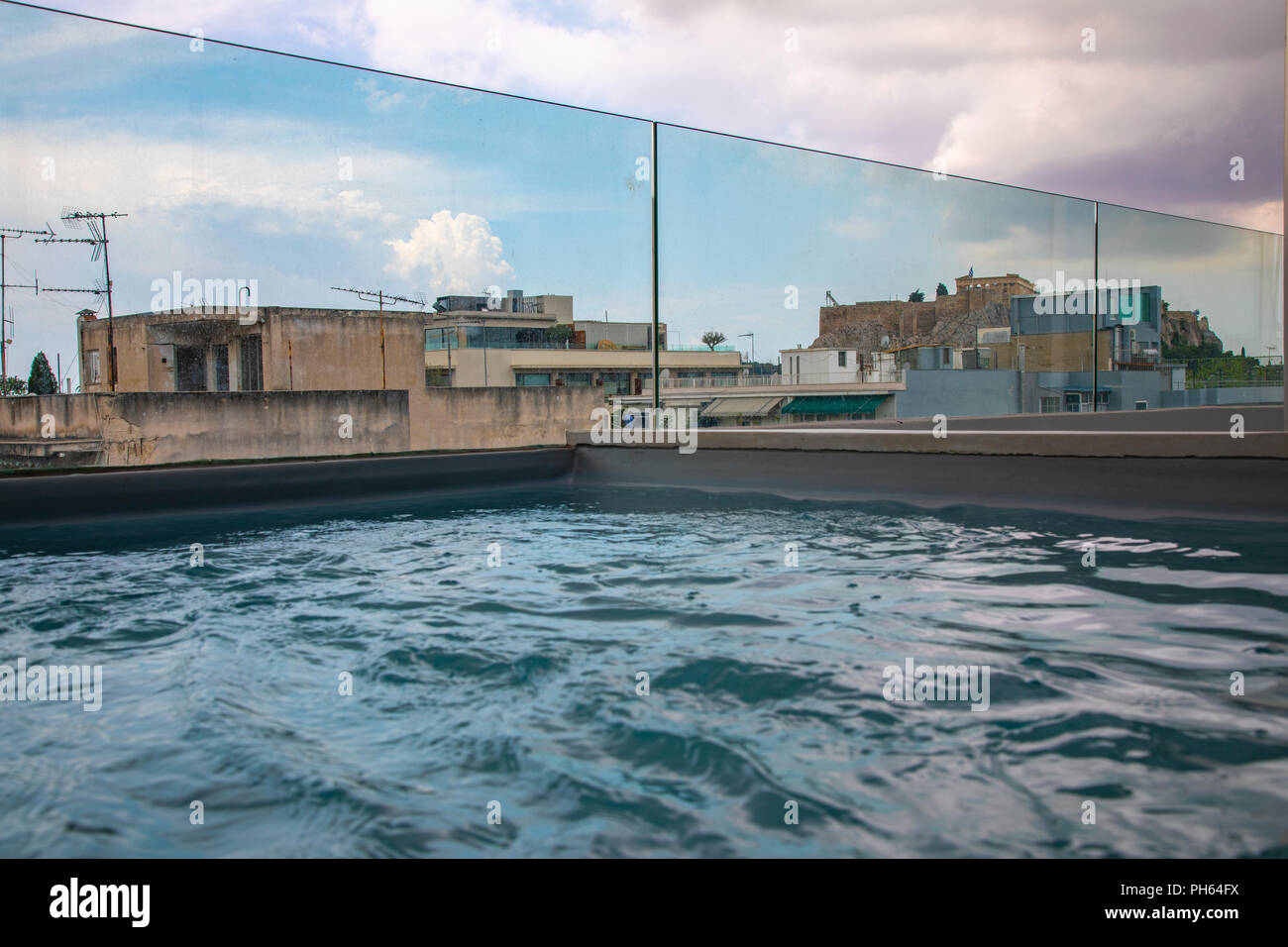 View of the Acropolis from the penthouse pool of financial district in ...
