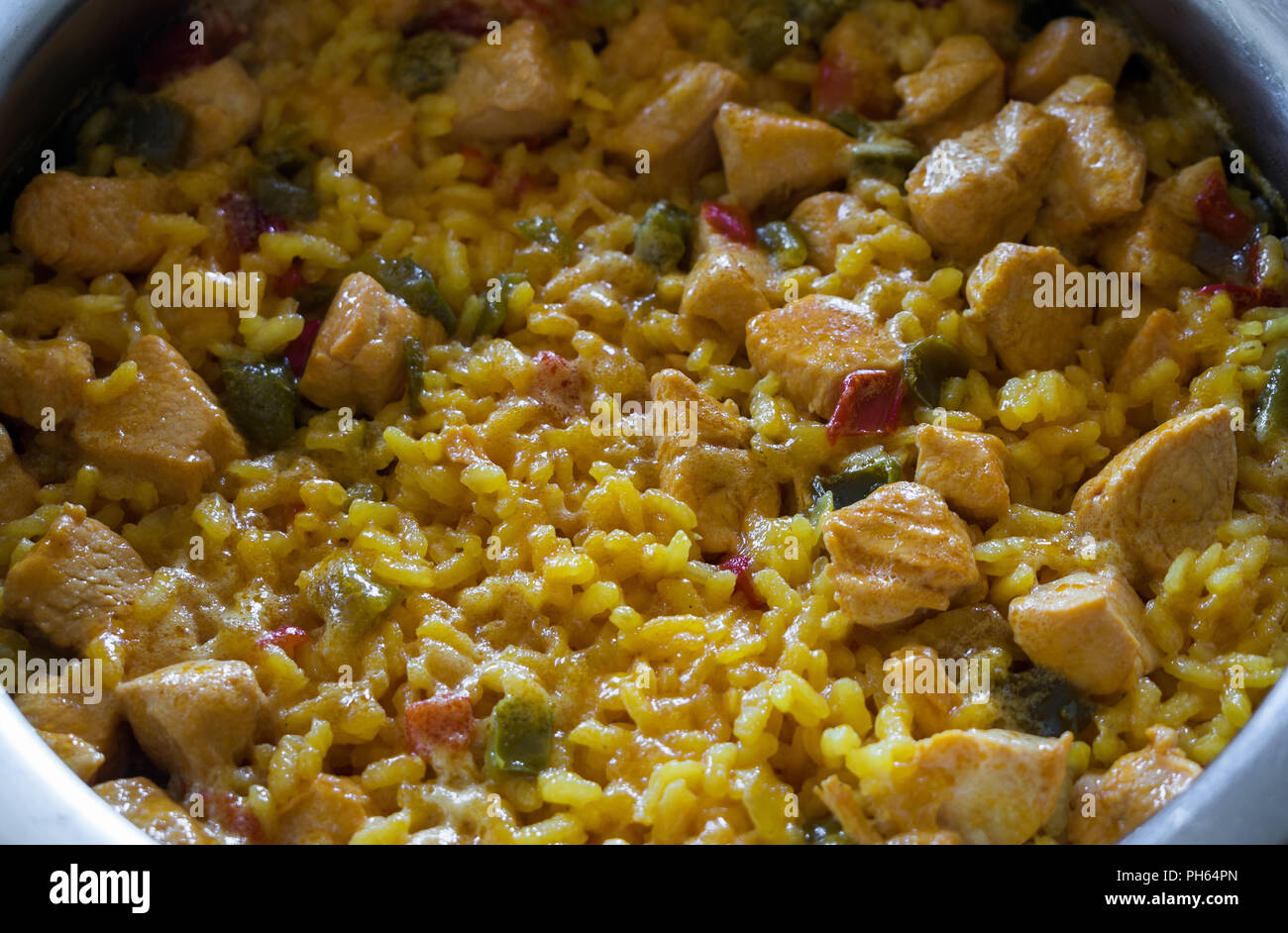 Stewed chicken with yellow rice and vegetables Stock Photo - Alamy