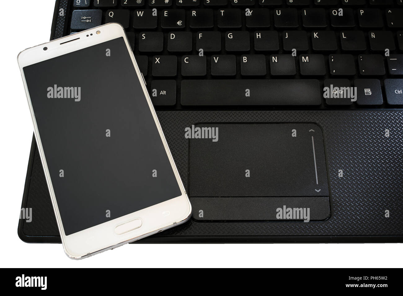 Laptop with smartphone on a white background. Common objects in an ...