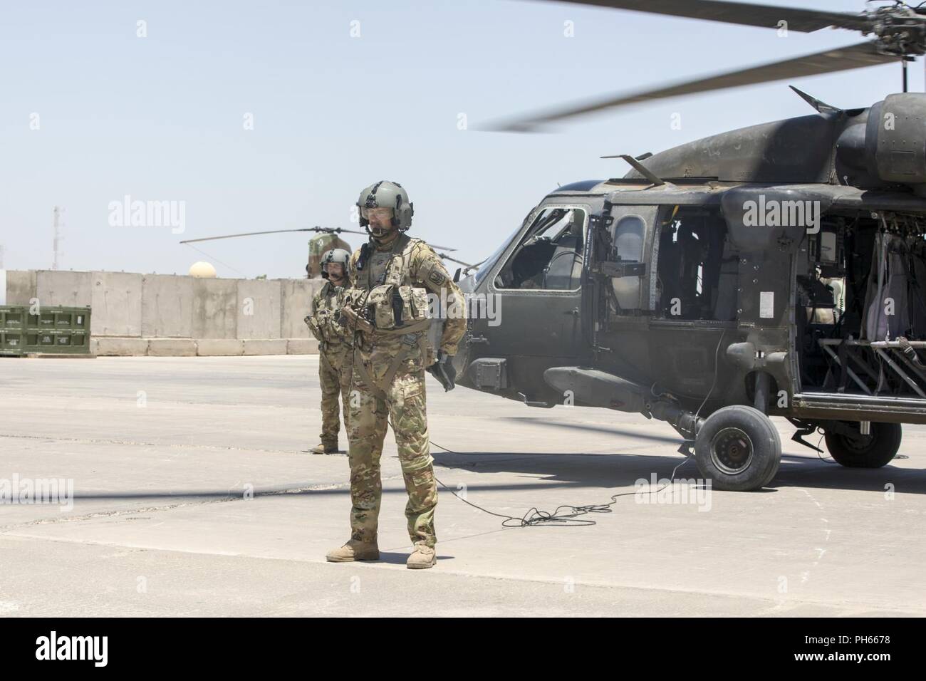 U.S. Army aviators, with Task Force Hurricane, await U.S. Army Maj. Gen ...
