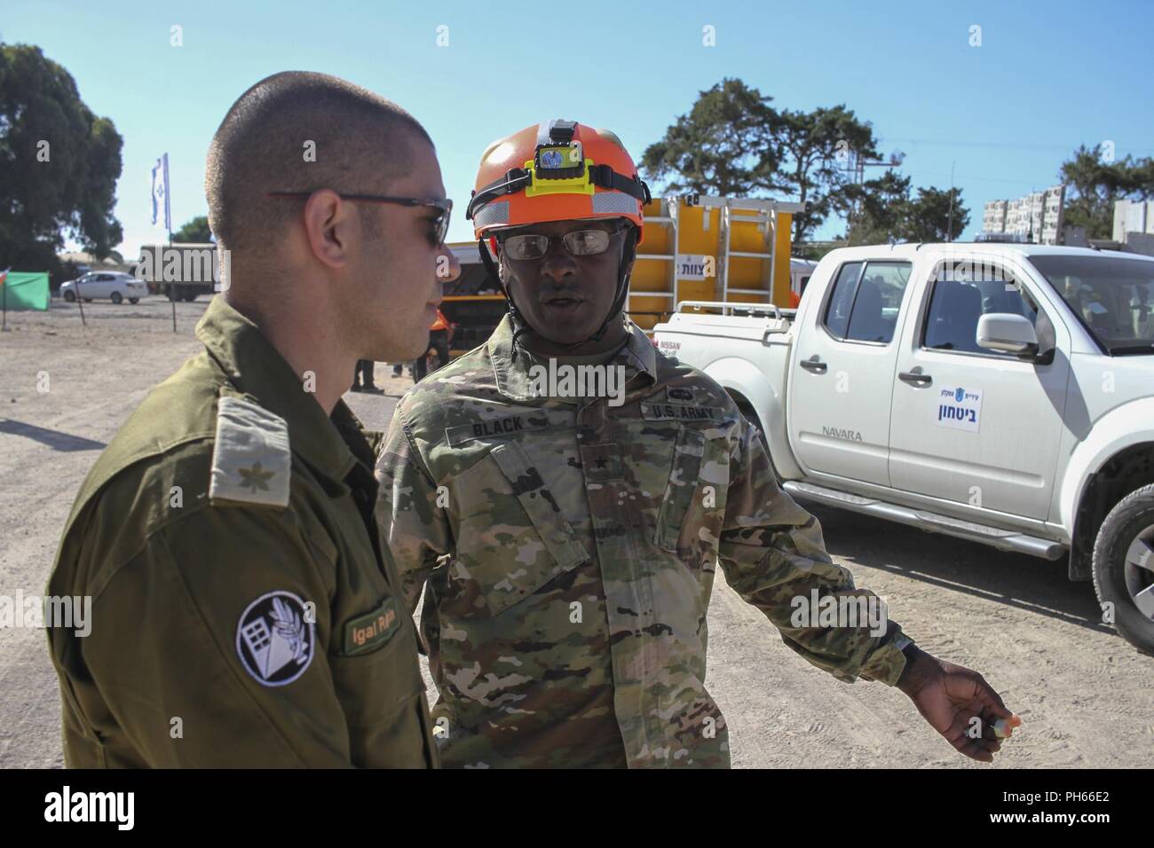 TEL AVIV, Israel – Israeli Defense Force Maj. Igal Raskin, left ...