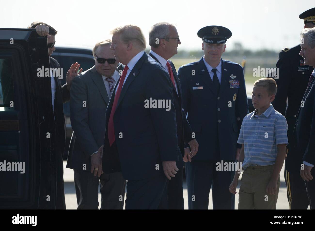 U.S. President Donald J. Trump prepares to get into a motorcade vehicle ...